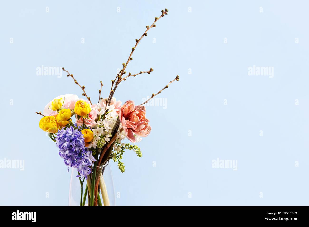 A bright spring bouquet of daffodils, hyacinths, roses, ranunculus ...