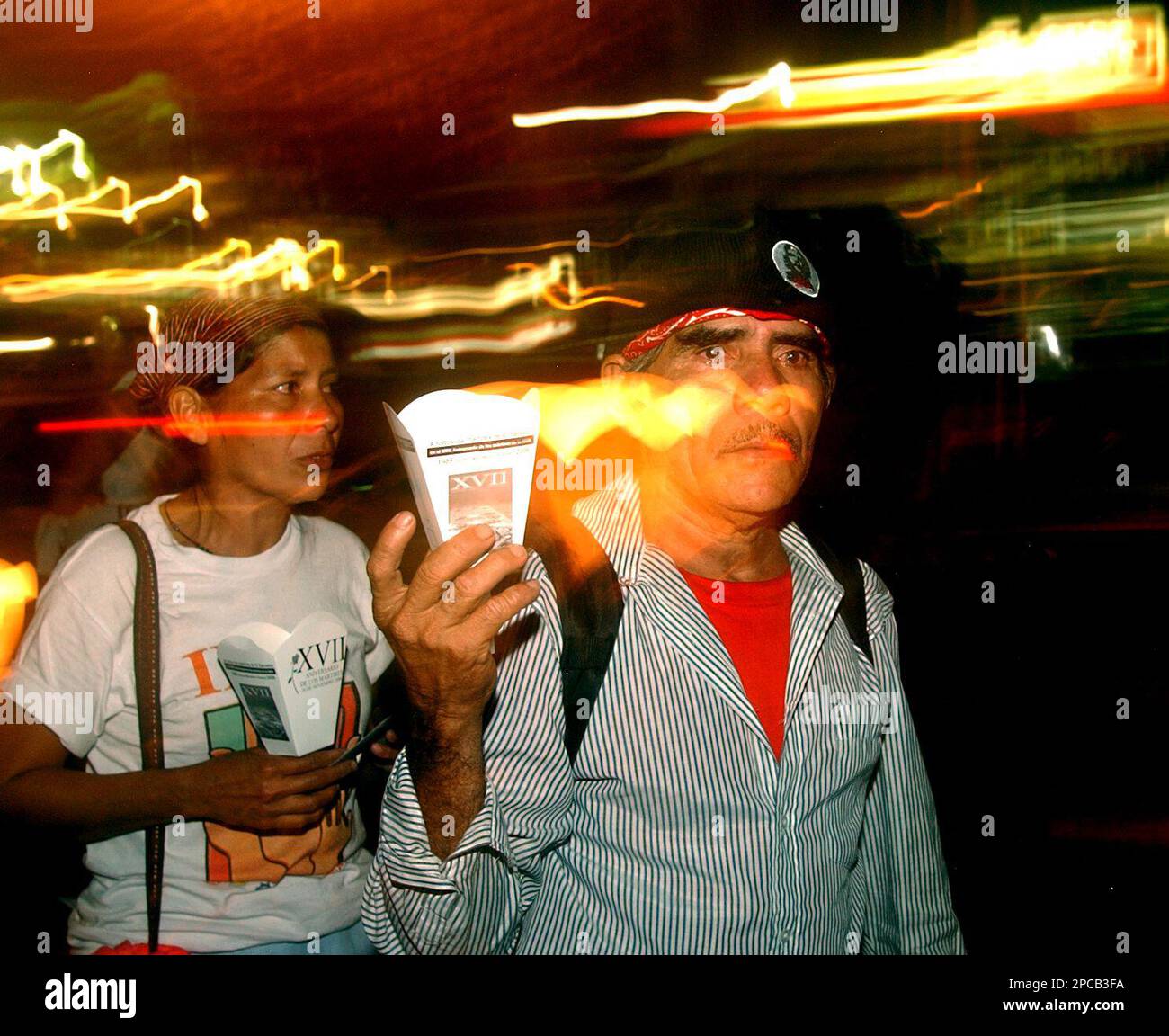People march, Saturday, Nov. 11, 2006, in San Salvador, El Salvador ...