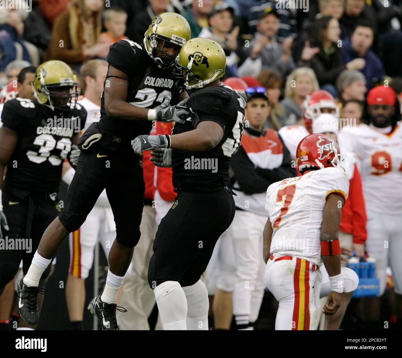 Colorado cornerback Lorenzo Sims Jr., left, celebrates with defensive ...