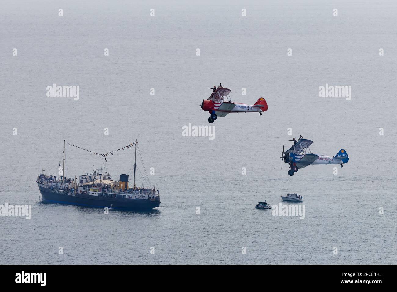 Biplane wing walkers at airshow Stock Photo - Alamy