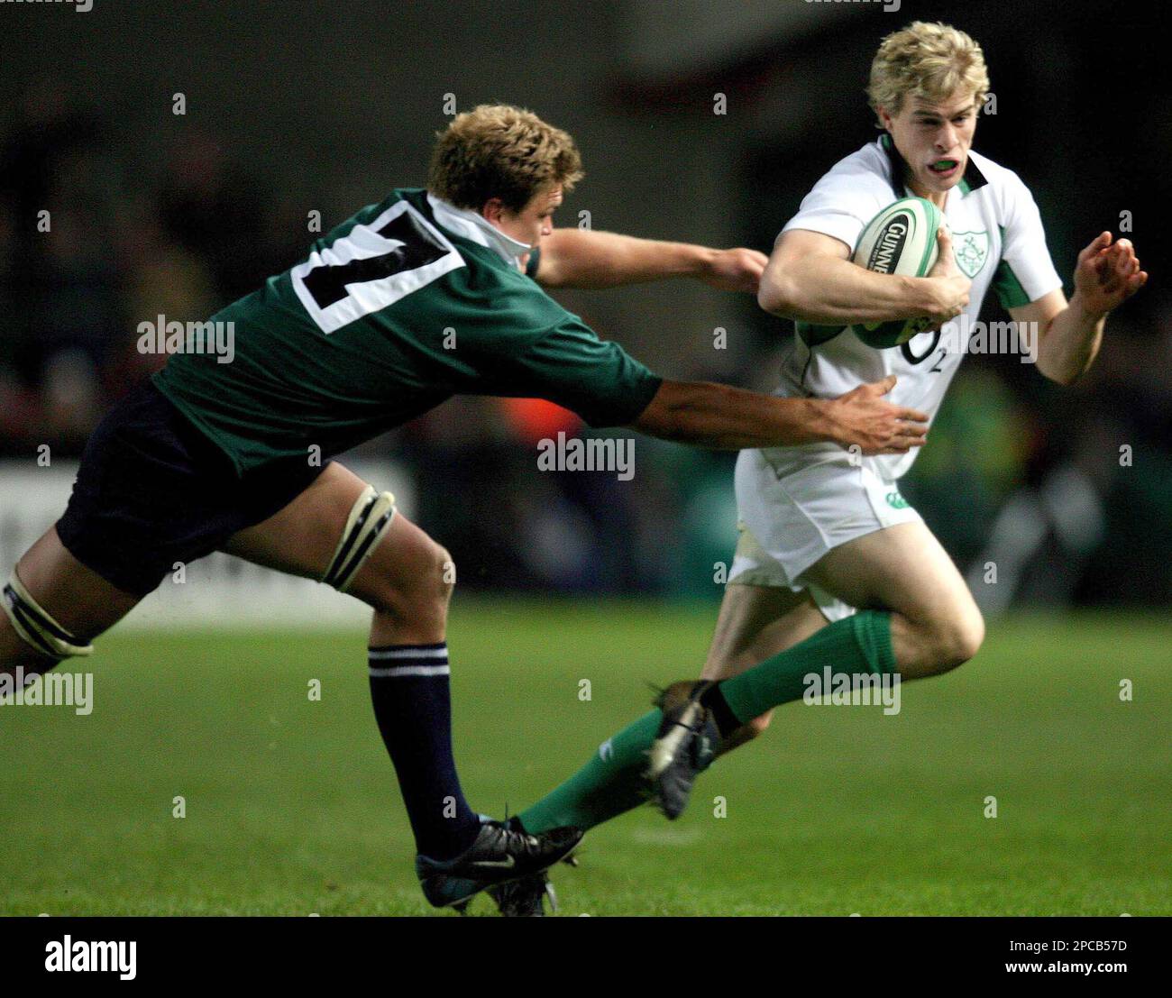 South Africa's Juan Smith holds off Ireland's Andrew Trimble, right, in ...