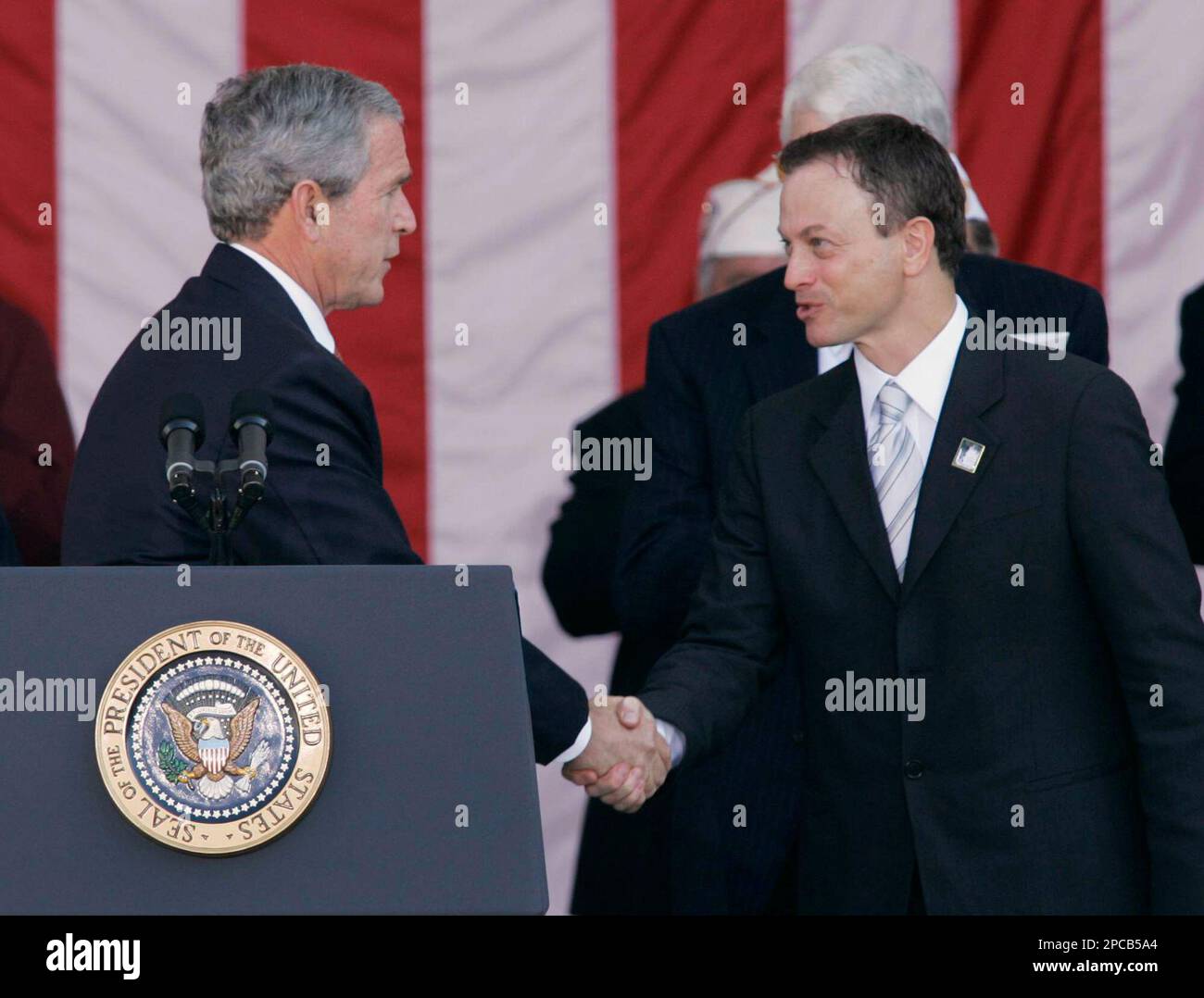 President Bush greets the master of ceremonies, actor Gary Sinise ...