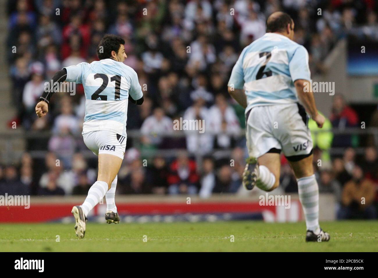 Argentina's Federico Todeschini, left, intecepts an England pass and ...