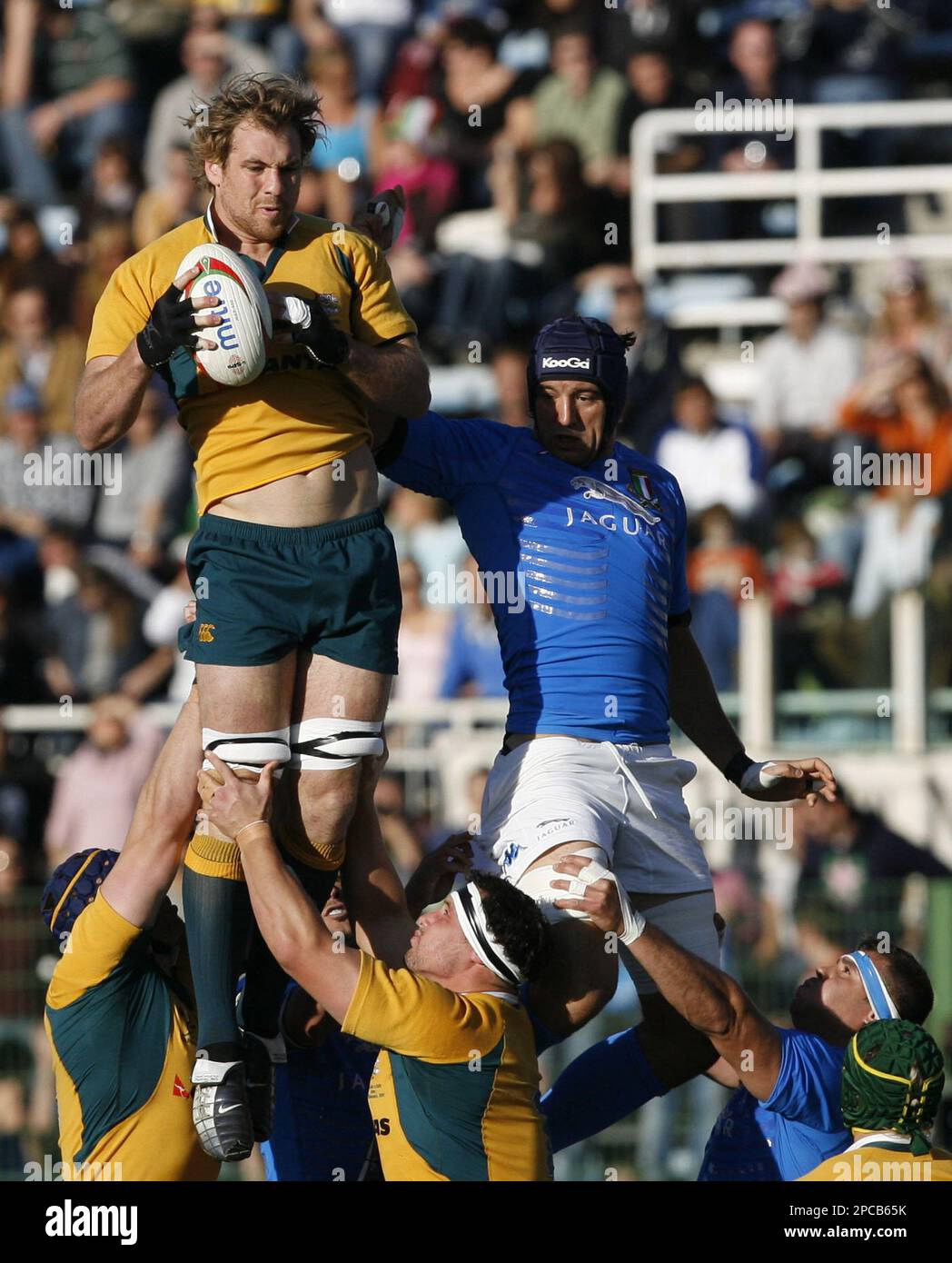 Australia's Rocky Elsom, left, and Italy's captain Marco Bortolami in a ...