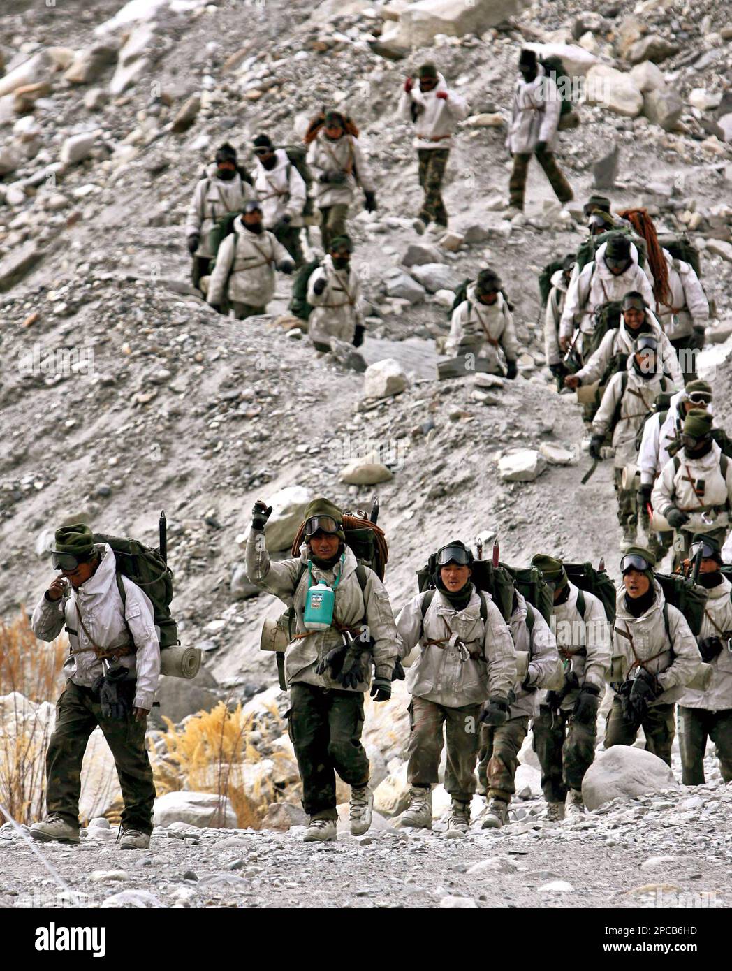 Indian Army soldiers arrive at their base camp after a training session ...