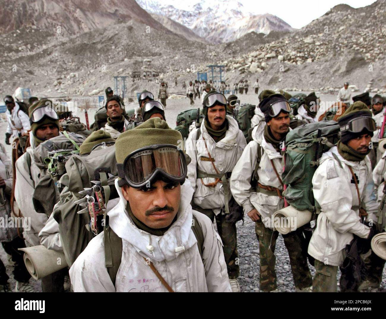 Indian Army soldiers arrive at their base camp after a training session ...