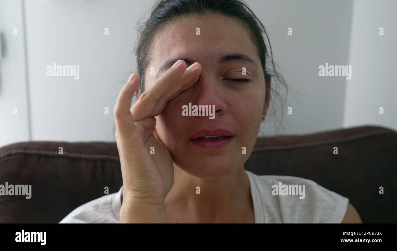 One sad tearful woman crying. Portrait of a depressed person close up ...