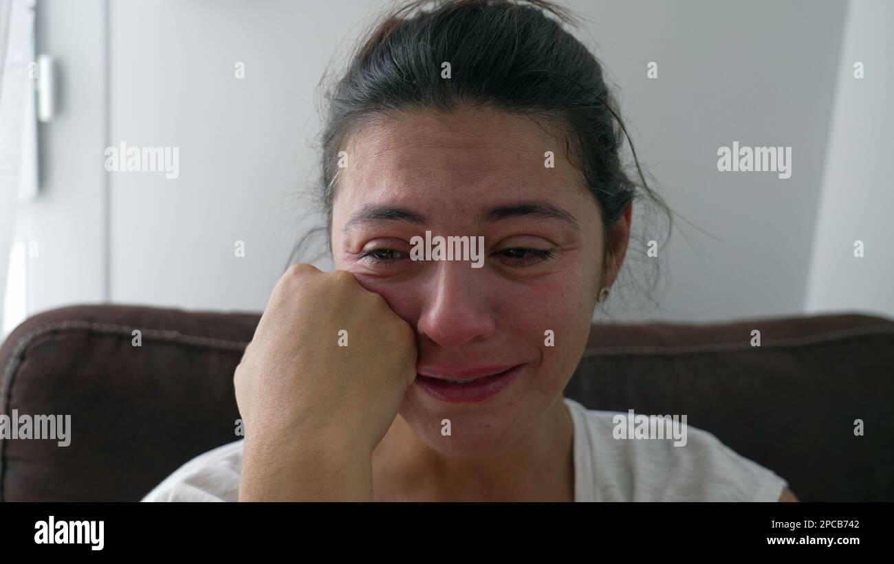 One sad tearful woman crying. Portrait of a depressed person close up ...