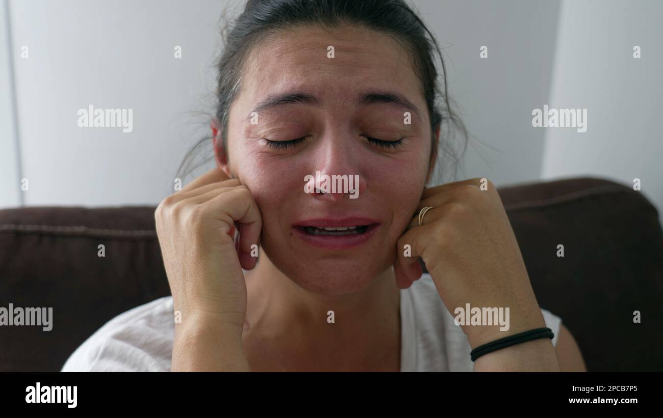 One sad tearful woman crying. Portrait of a depressed person close up ...