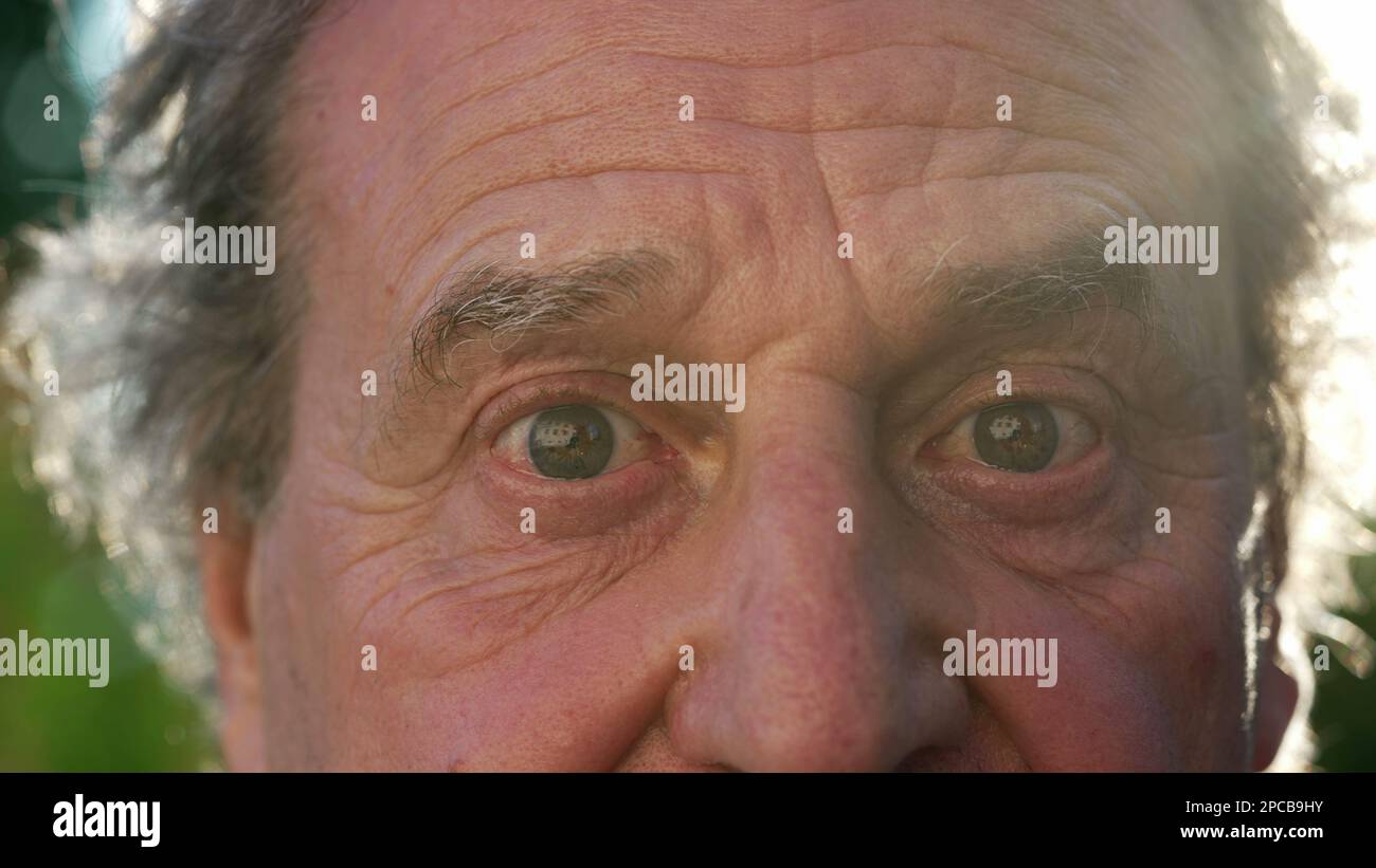One mature senior man SHOCK reaction. Macro close up eyes of older ...