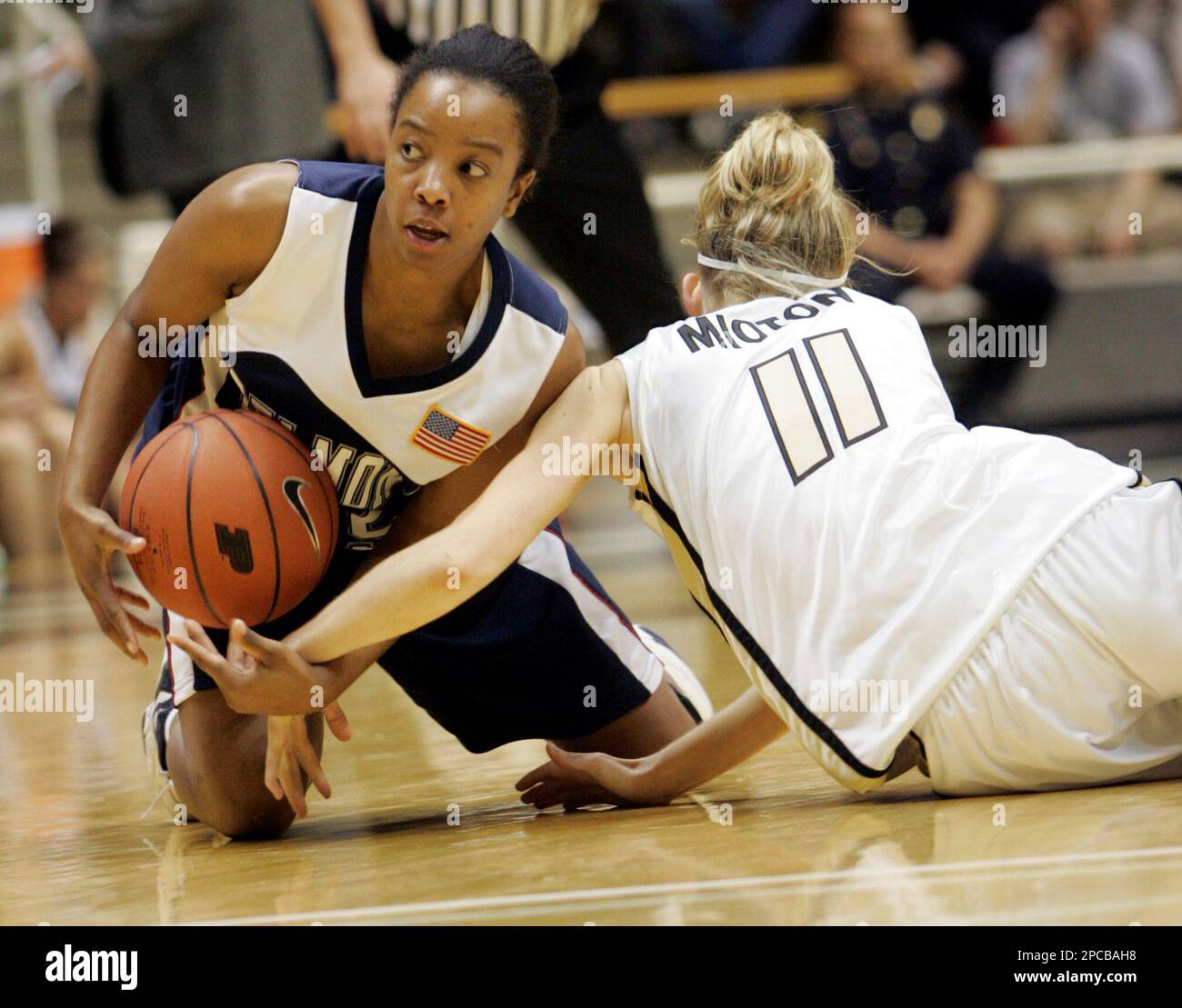 Belmont's LaWanna Holiday, left, goes after a loose ball with Purdue's ...