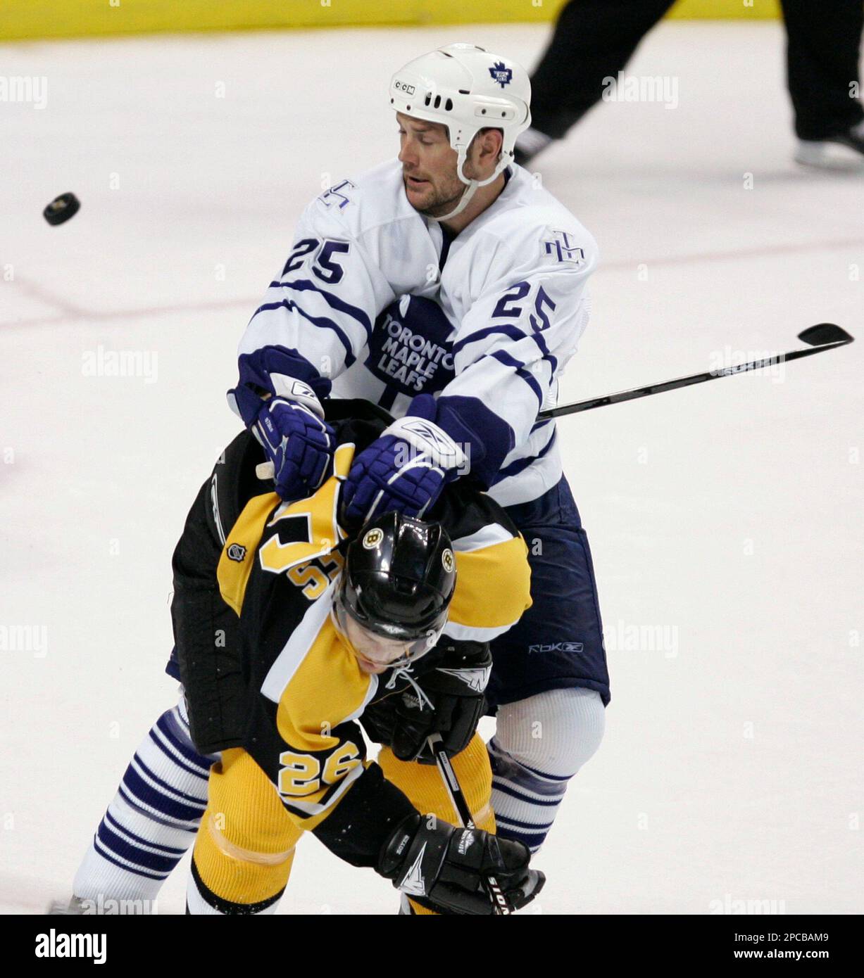 Toronto Maple Leafs defenseman Hal Gill, top, covers Boston Bruins ...