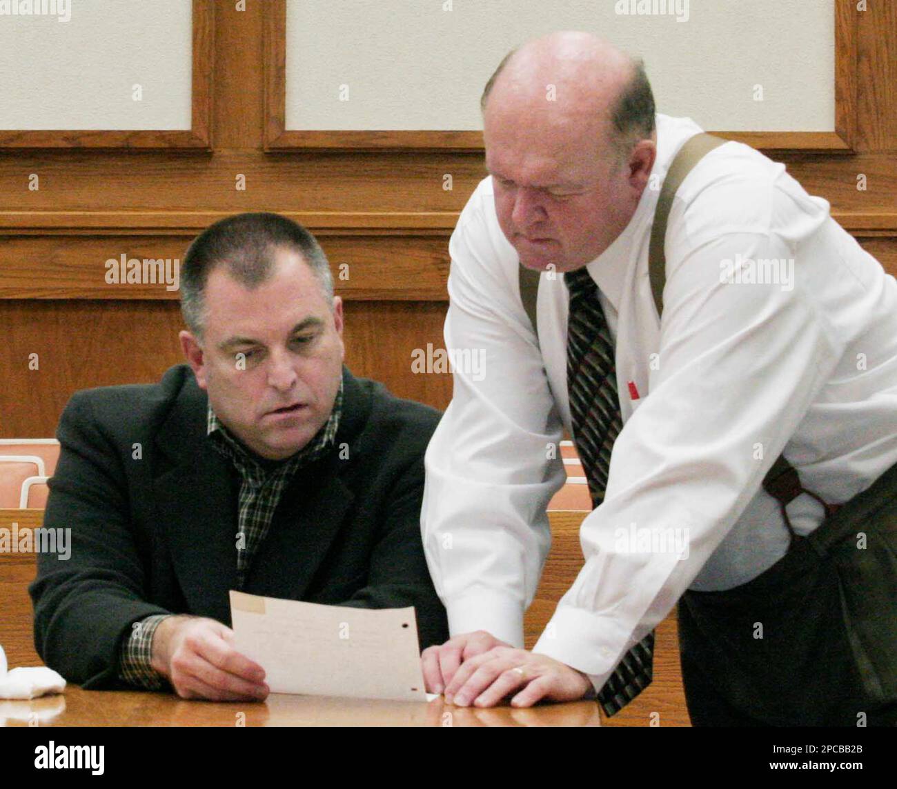 Tom Noe, left, talks with his lawyer Bill Wilkinson while waiting for a ...