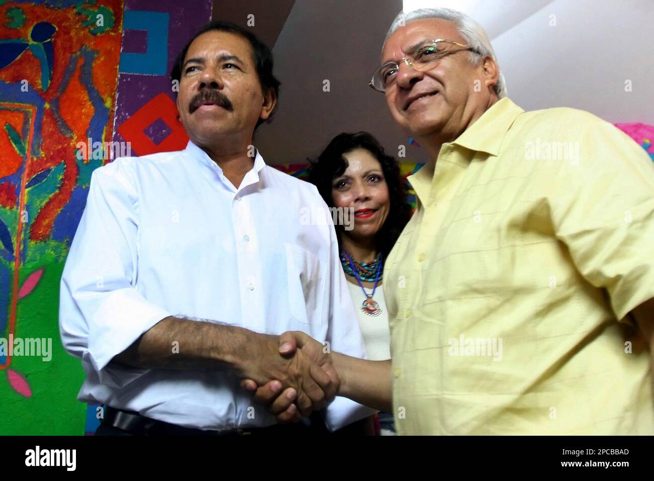 President-elect of Nicaragua Daniel Ortega shakes hands with Jose Rizo ...