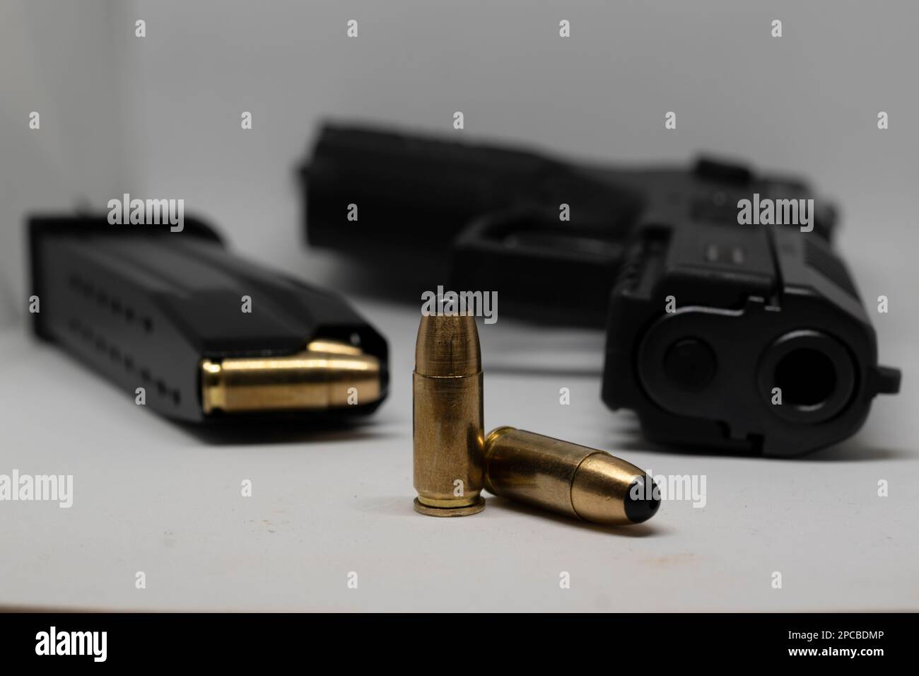 Pistol and two magazine Stock Photo - Alamy