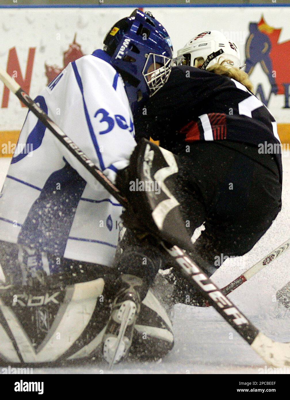 United States' Krissy Wendell, right, crashes into Finland goalie Mira ...