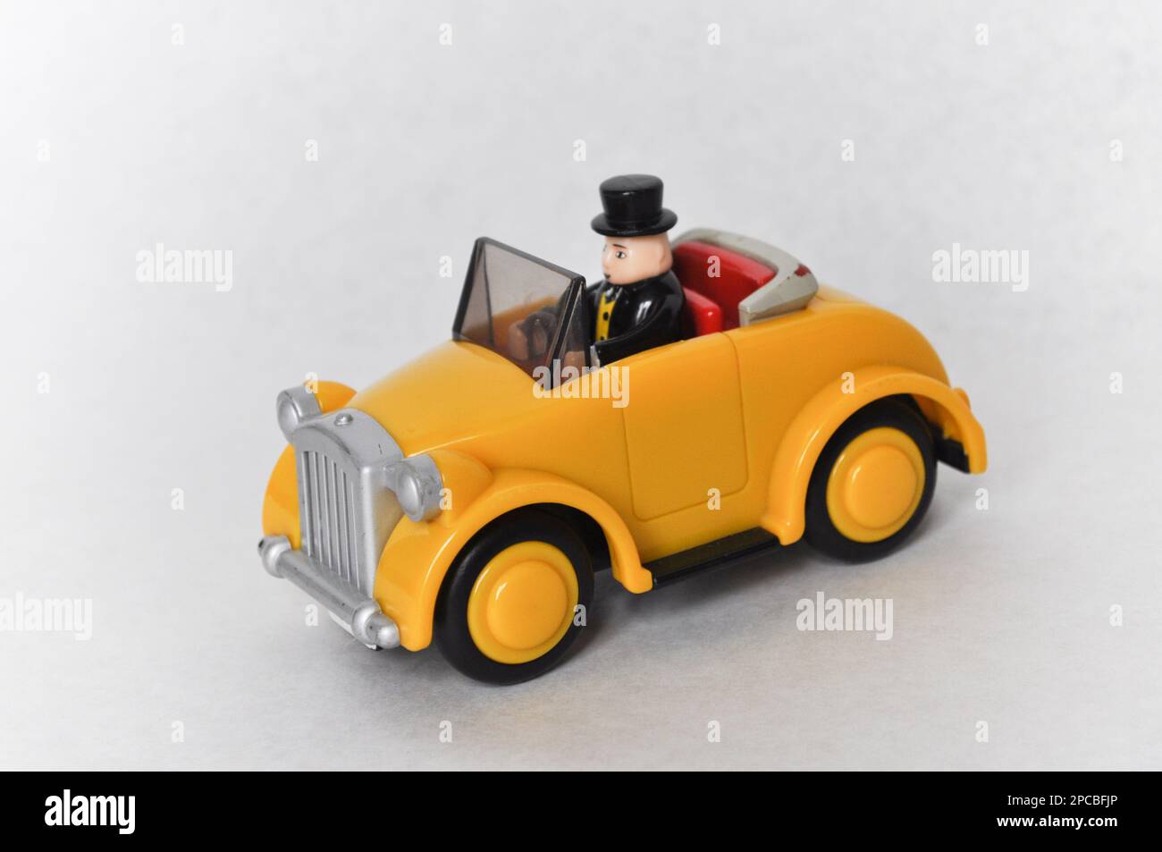 Sir Topham Hatt (The Fat Controller) figure driving a yellow plastic ...