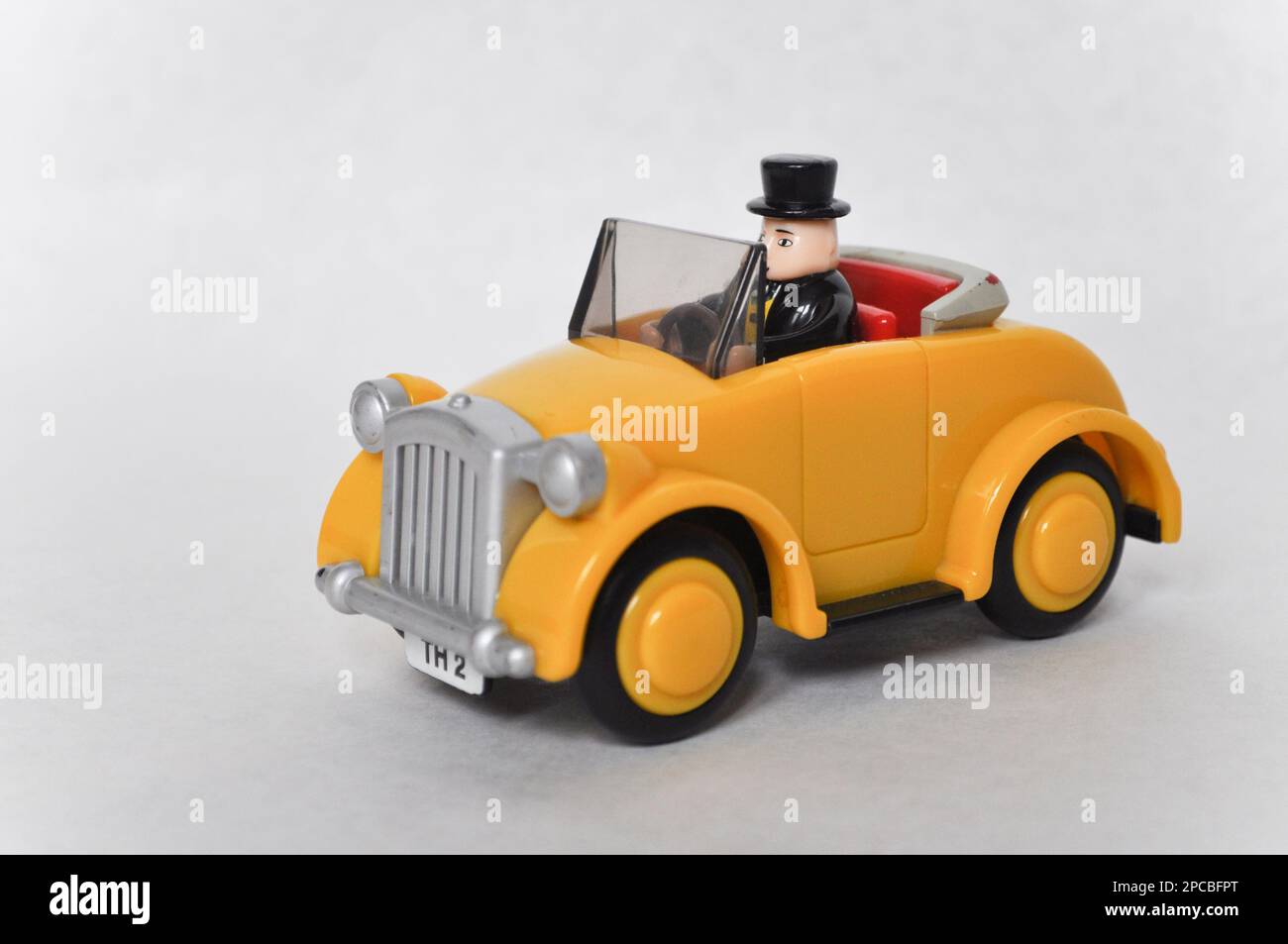 Sir Topham Hatt (The Fat Controller) figure driving a yellow plastic ...
