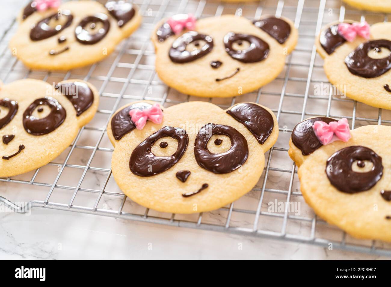Panda shaped shortbread cookies with chocolate icing Stock Photo - Alamy