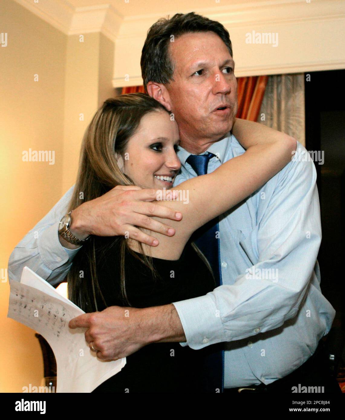 Democratic candidate for Congress Tim Mahoney ,right, hugs his daughter ...