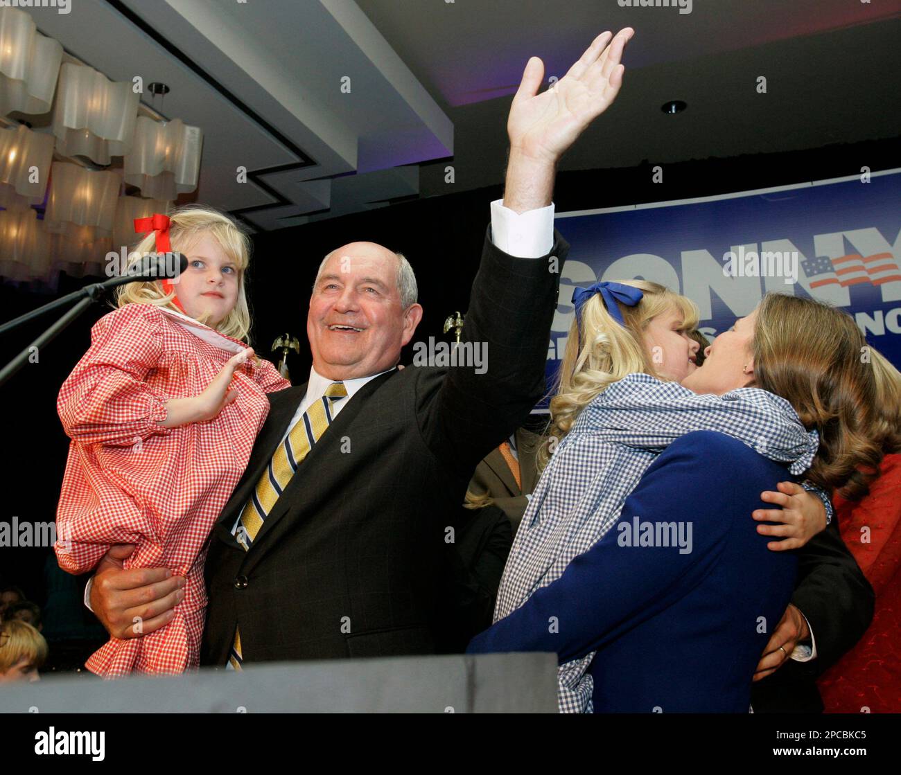 Republican Gov. Sonny Perdue holds twin granddaughter Mary Kate as ...