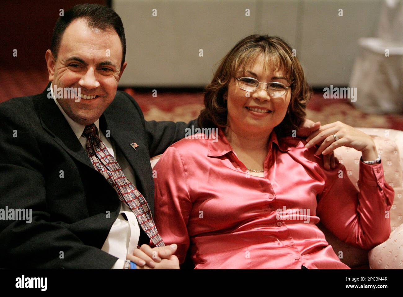 Democrat Tammy Duckworth and her husband, Bryan Bowlsbey, watch early ...