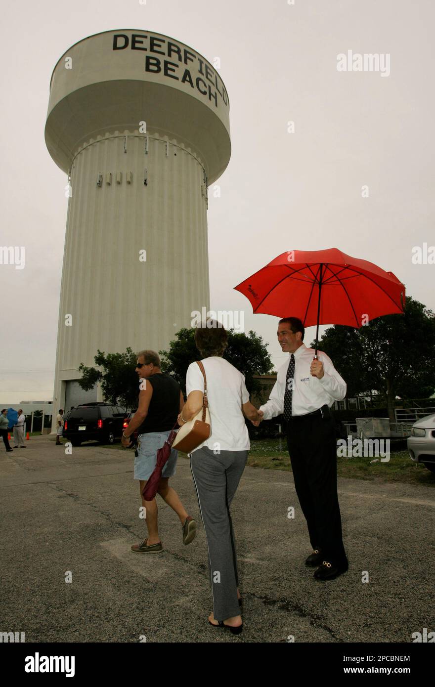 State Sen. Ron Klein, right, greets voters outside a polling station ...