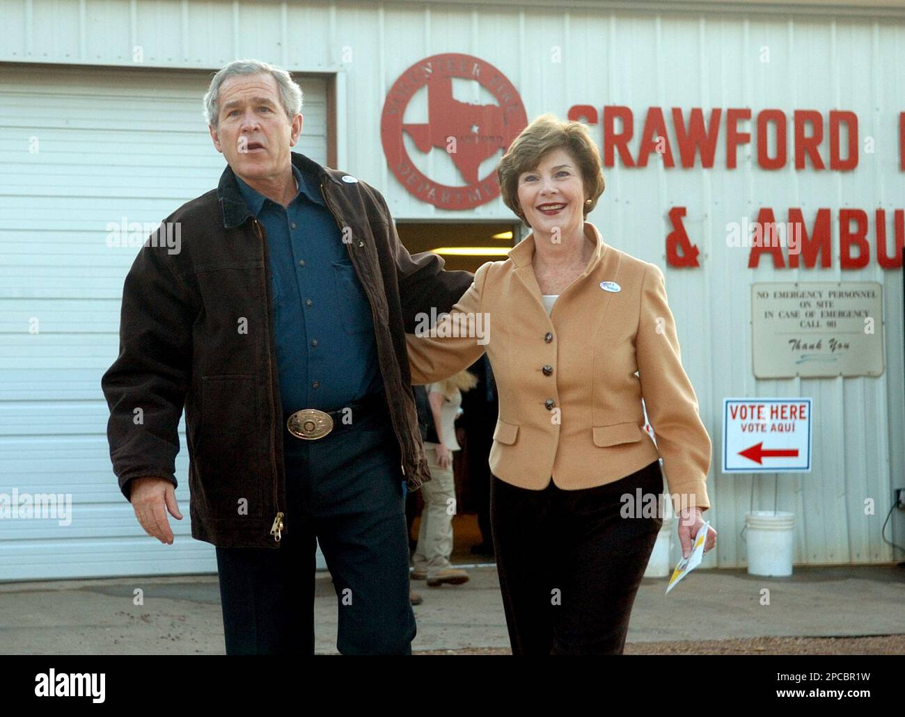President Bush and his wife Laura talk outside the Crawford Fire ...
