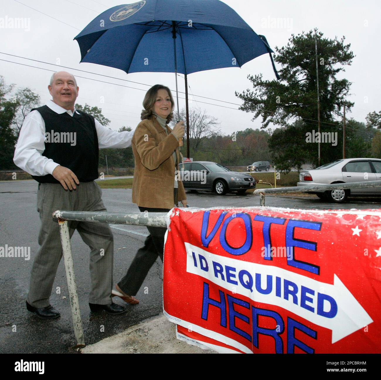 Gov. Sonny Perdue, left, arrives at his polling place with his wife ...