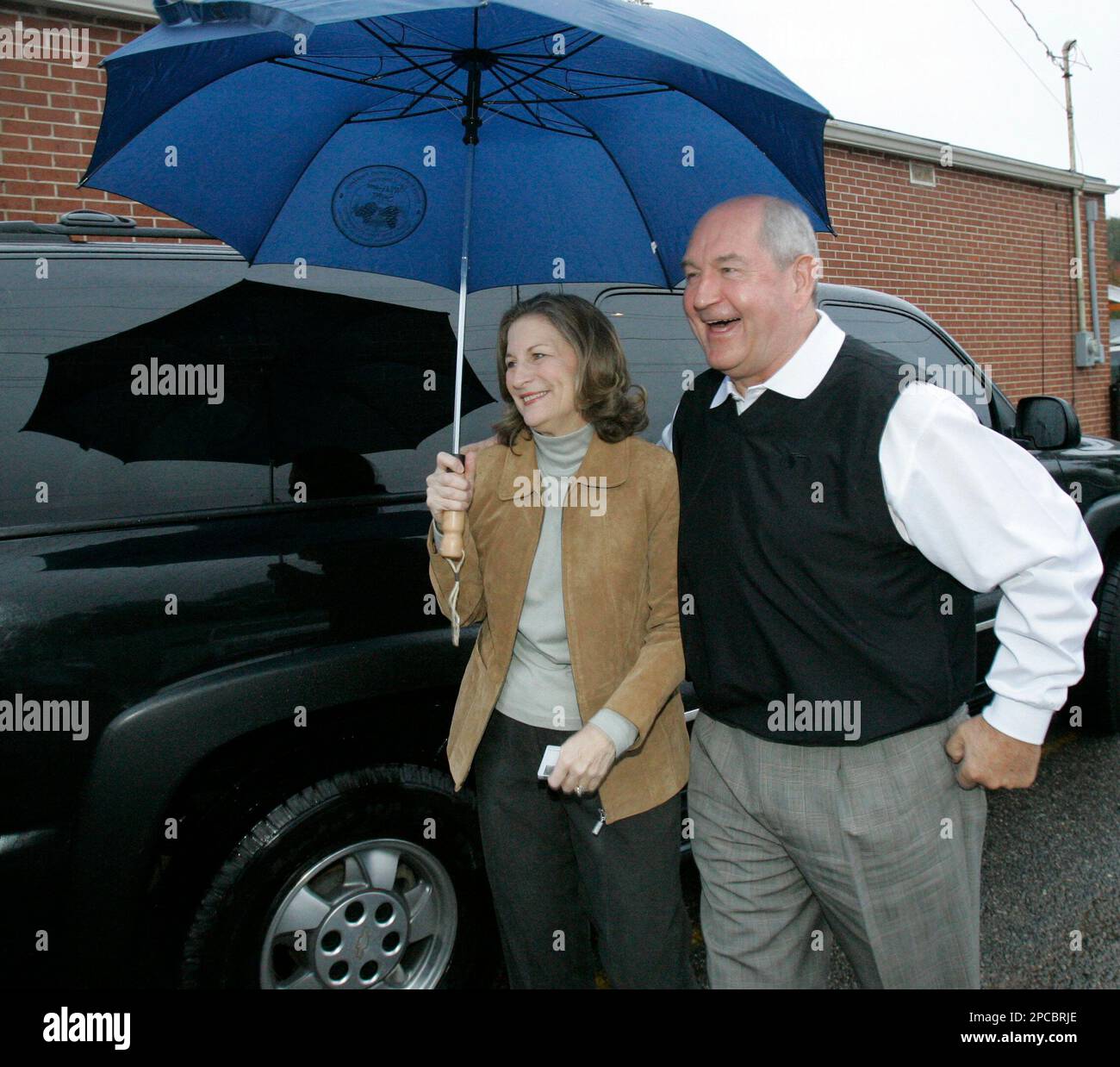 Gov. Sonny Perdue, right, arrives at his polling place with his wife ...