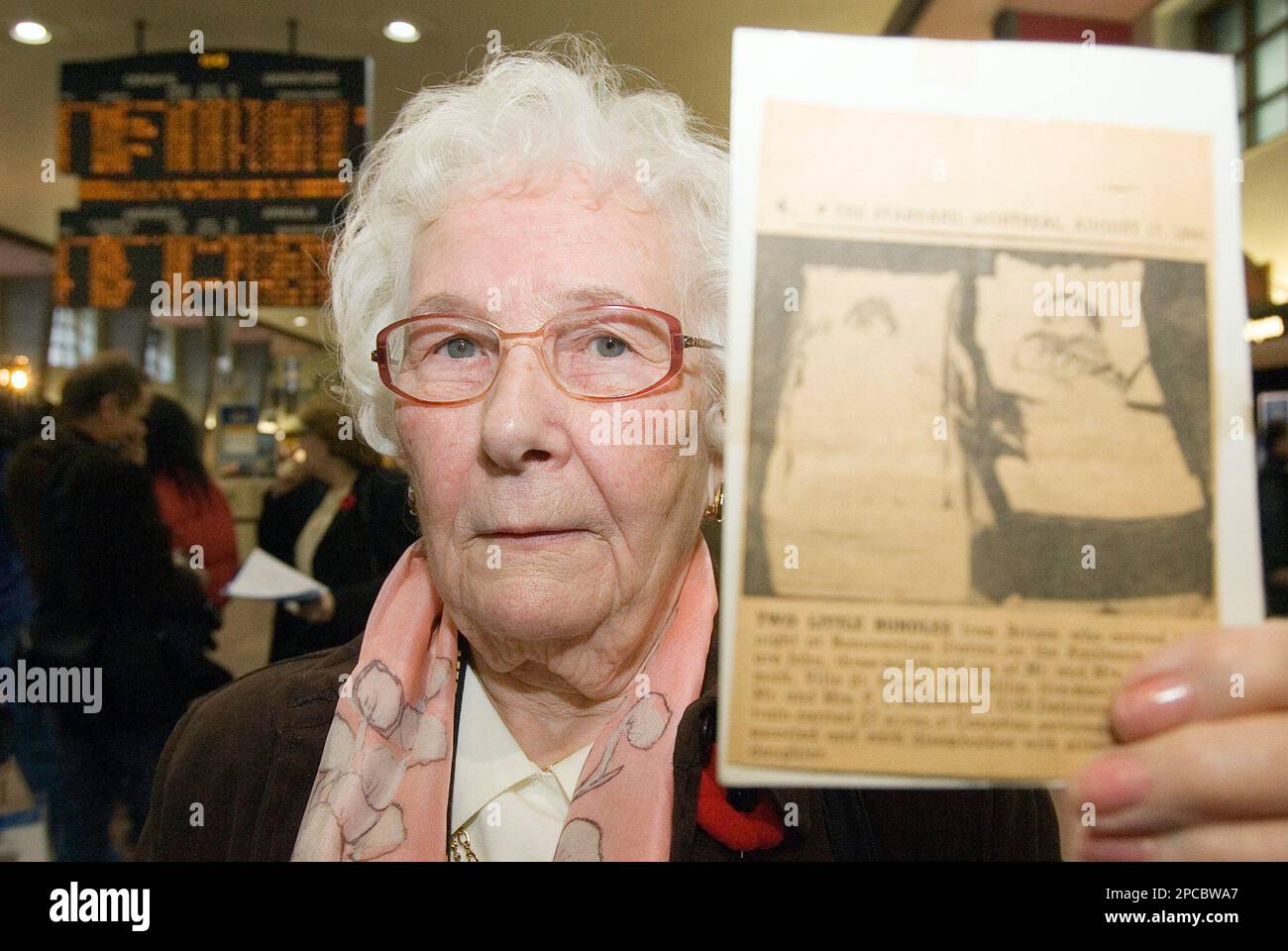 Dorothy McCormick shows off a photograph of her children published in a ...