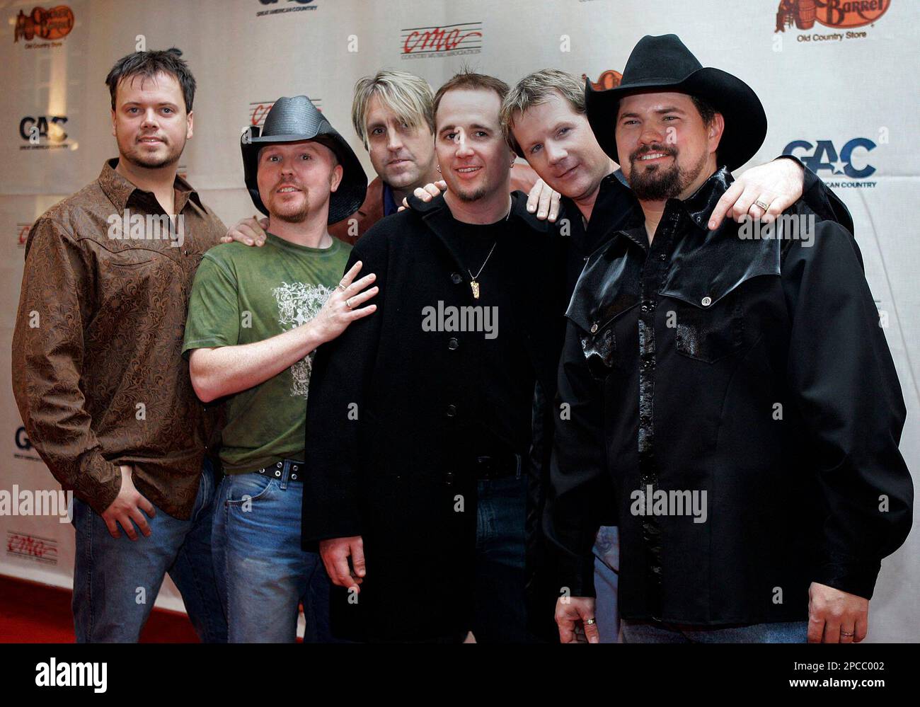 Members of the country music group Heartland pose for photos during ...