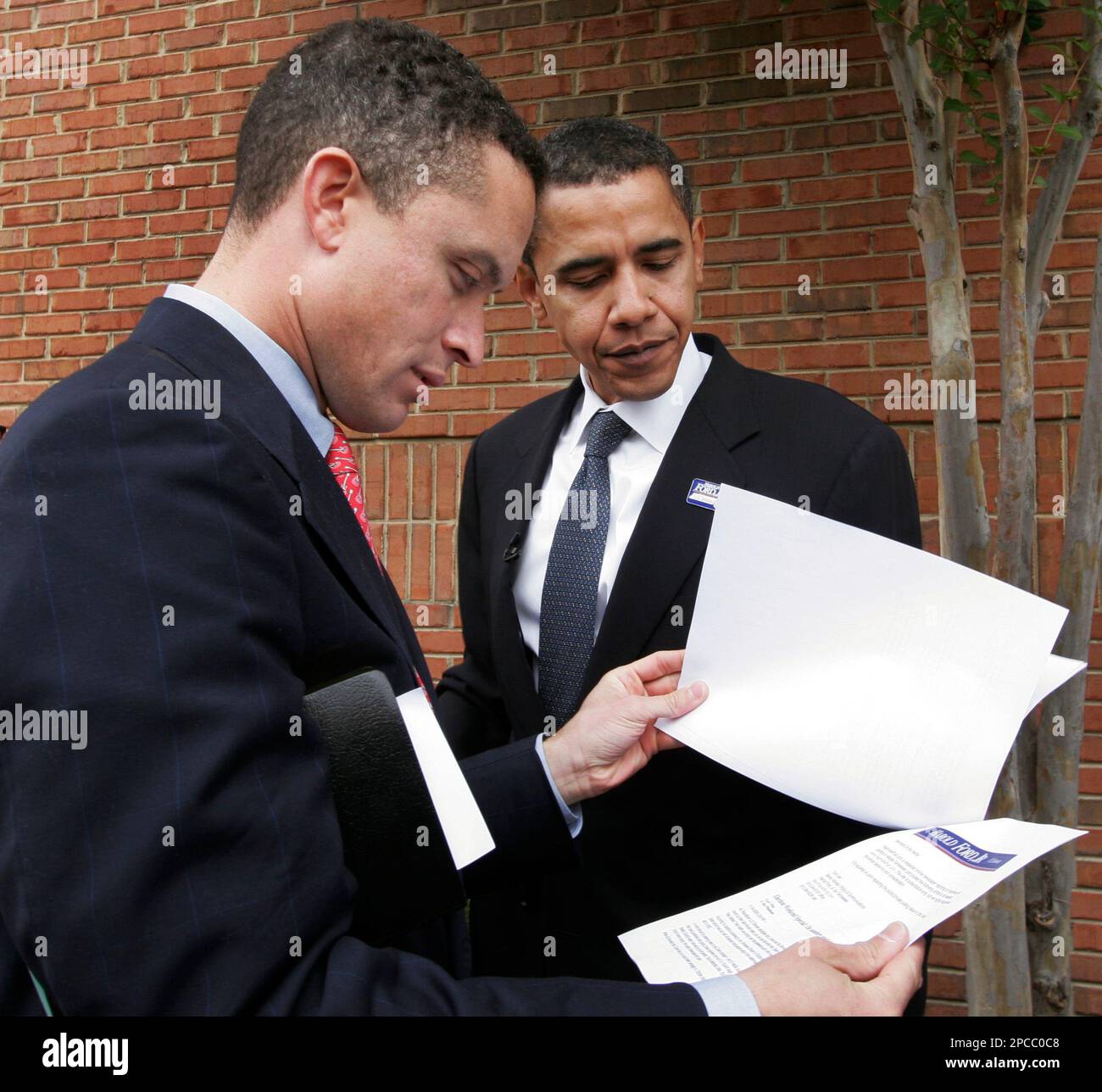 Democrat Harold Ford Jr. left, looks at some campaign literature with ...