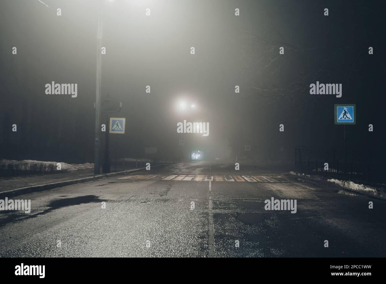 Dark foggy noire rainy street, empty road Stock Photo - Alamy