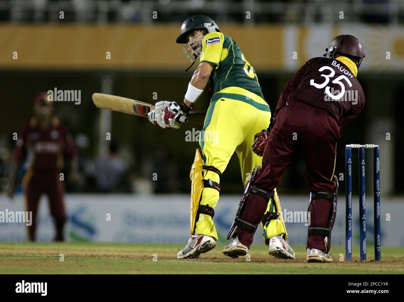 Australian cricketer Shane Watson looks at the ball after playing a ...