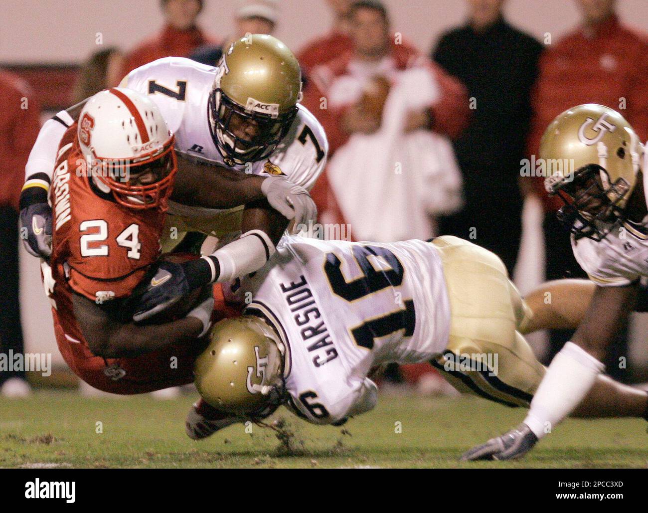 North Carolina State's Andre Brown (24) is brought down by Georgia Tech ...