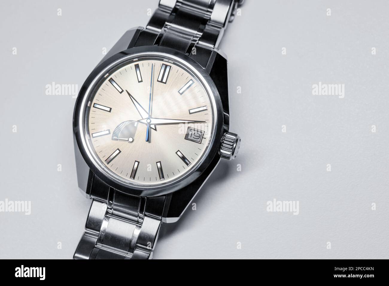 Automatic wrist watch lays on a white table, top view Stock Photo - Alamy