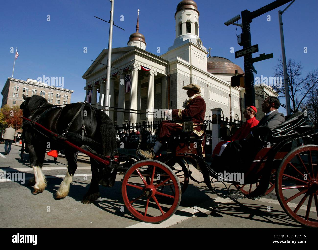 A horse drawn carriage takes re-enactors in front of the Basilica of ...