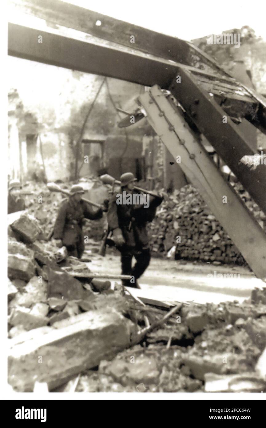 World War Two B&W photo German Soldiers in a ruined town carry ...
