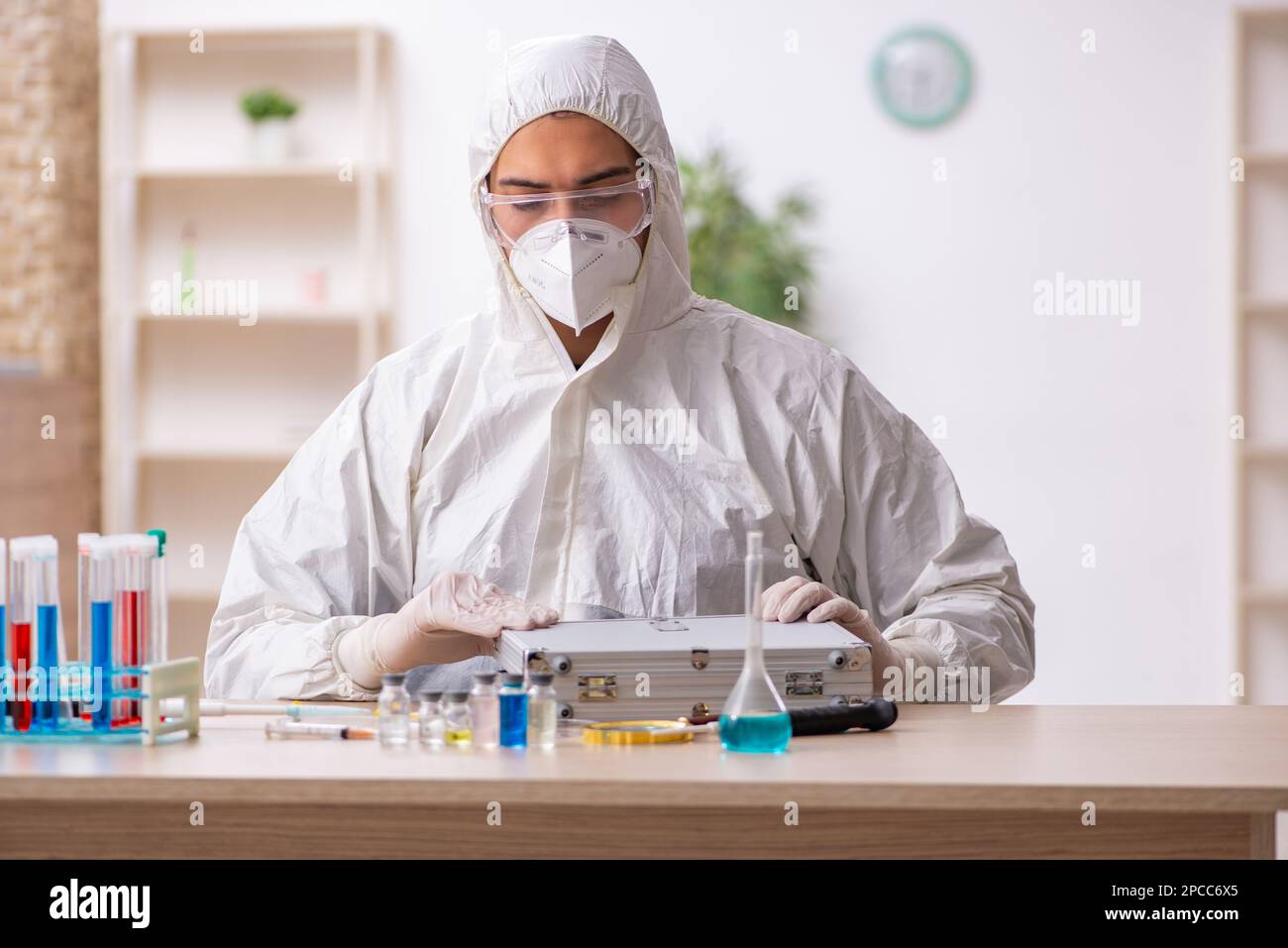 Young chemist working at the lab during pandemic Stock Photo - Alamy