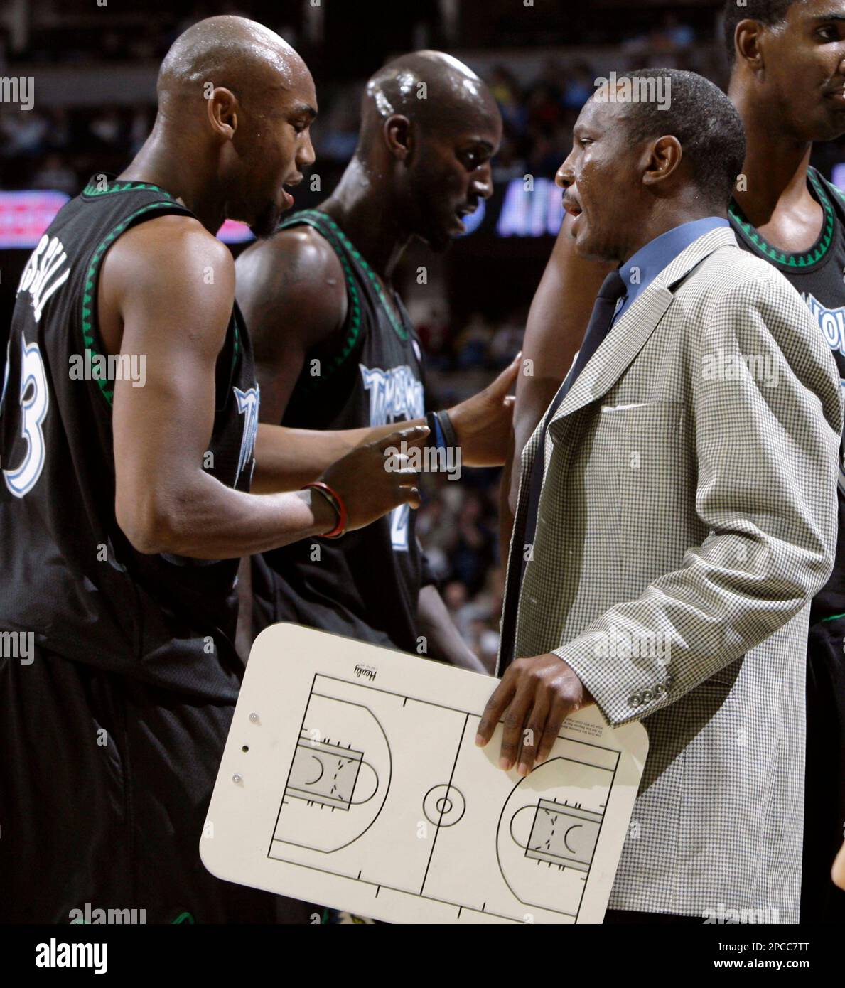 Minnesota Timberwolves guard Mike James, front left, confers with coach ...