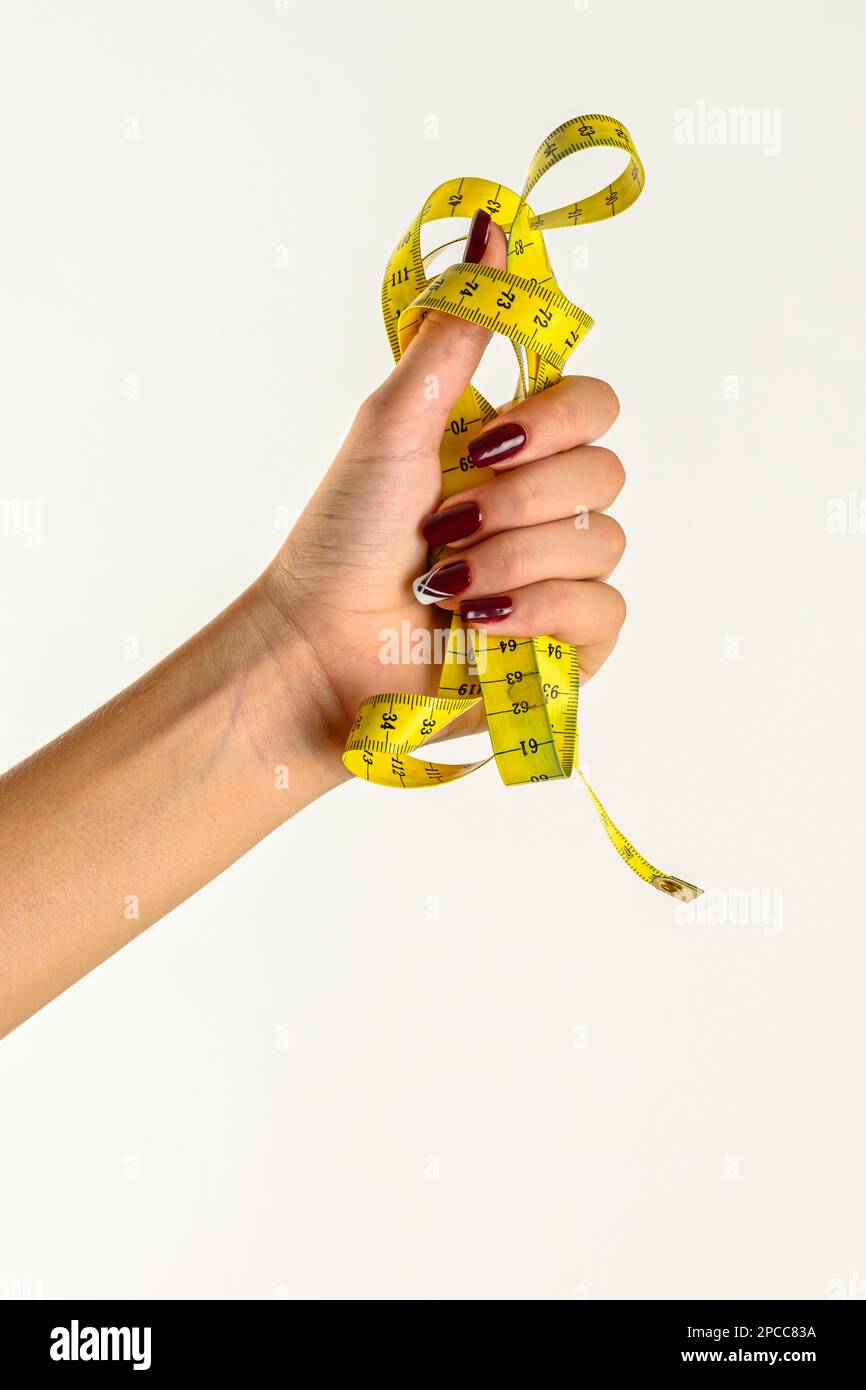 Woman hands with tape measure hi-res stock photography and images - Alamy