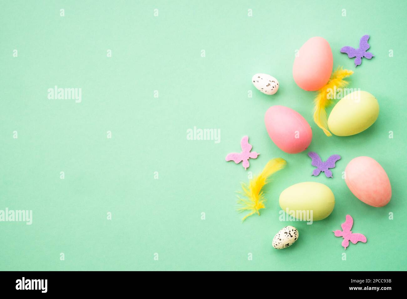Easter background with Eggs, rabbit and spring flowers at green ...