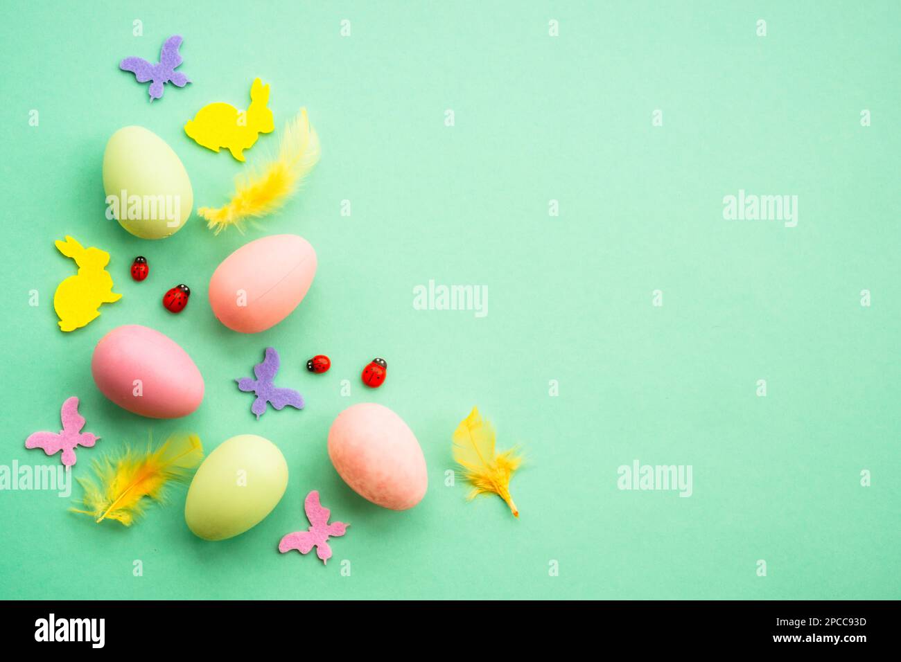 Easter background with Eggs, rabbit and spring flowers at green ...