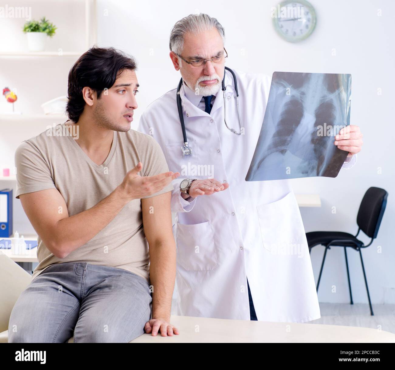 The young man visiting old male doctor radiologist Stock Photo - Alamy