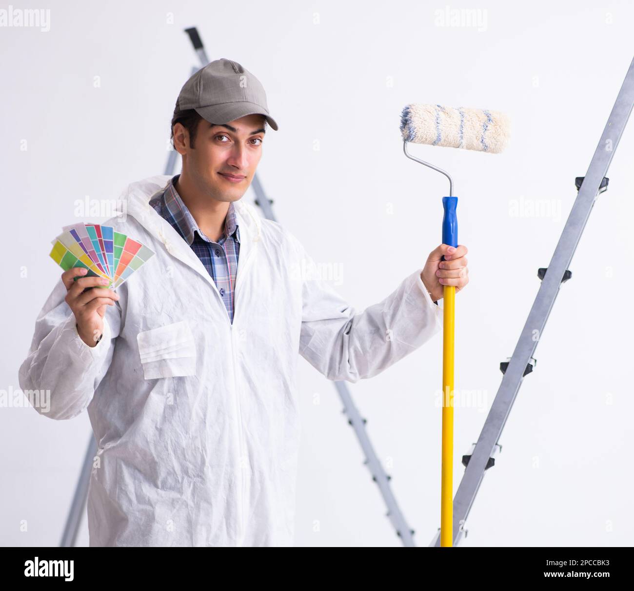 Painter working at the construction site Stock Photo - Alamy