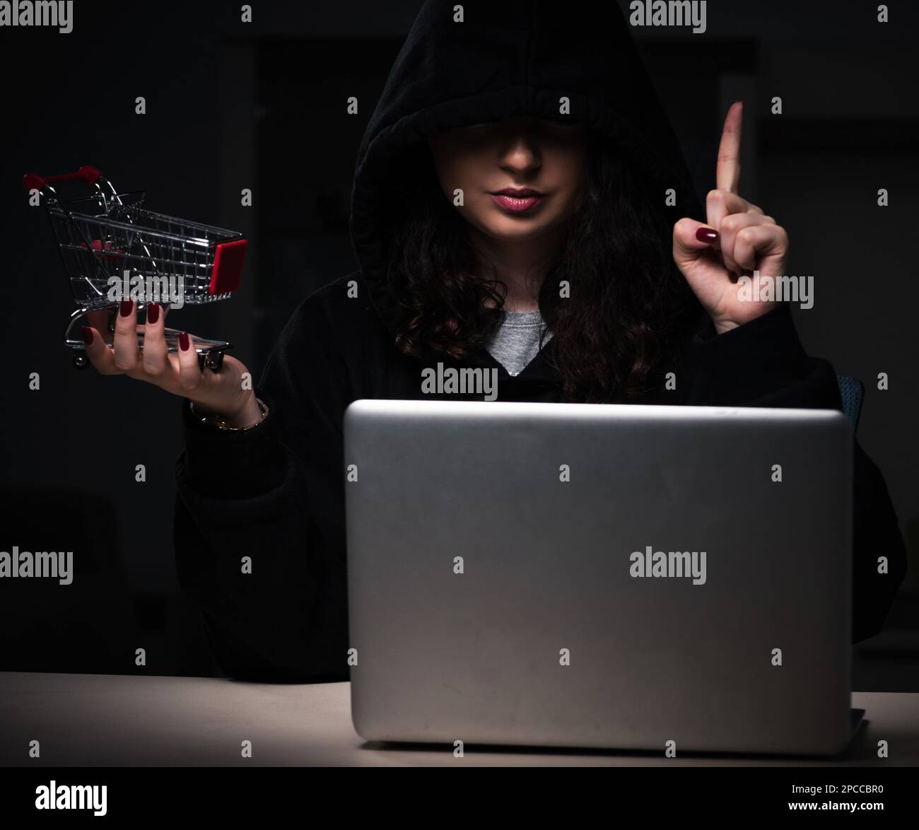 The female hacker hacking security firewall late in office Stock Photo ...