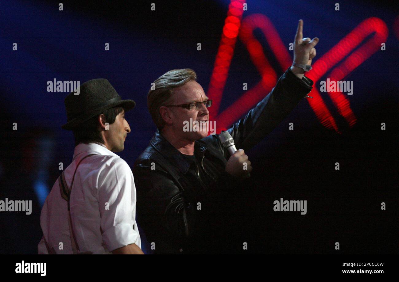 Andrew Fletcher of Depeche Mode, centre, accepts the best group award ...