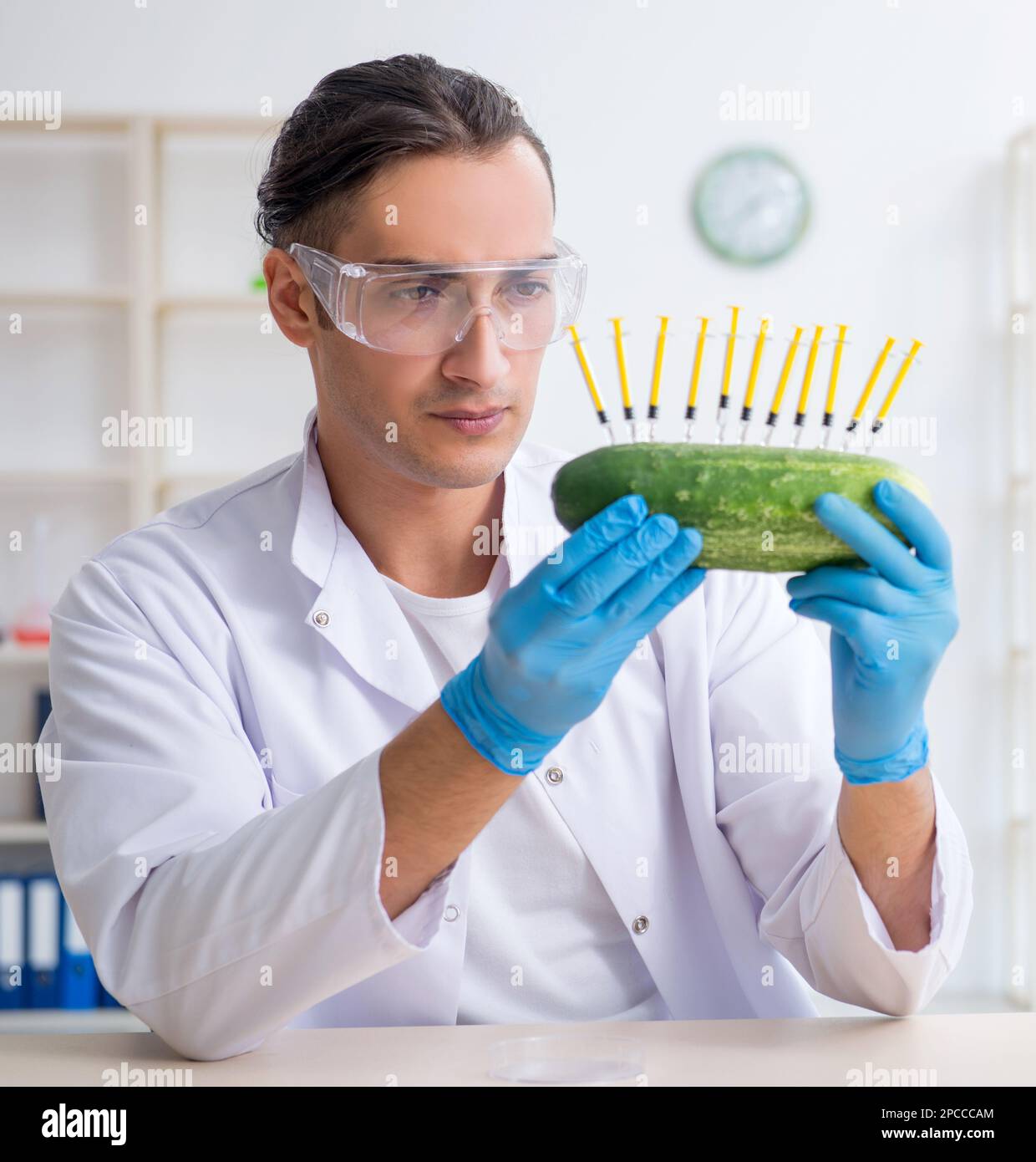 The male nutrition expert testing vegetables in lab Stock Photo - Alamy