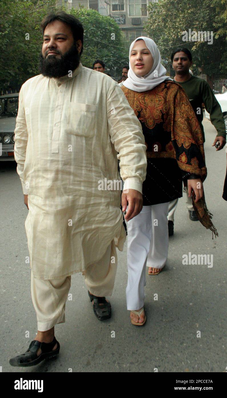 Sajad Ahmed Rana, left, escorts his Scottish daughter Molly Campbell ...